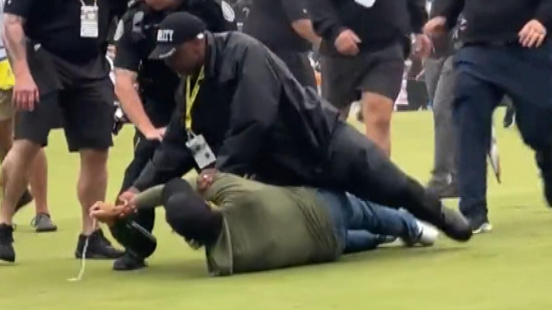 Hadwin tackled by security on his way to celebrate with Nick Taylor ...