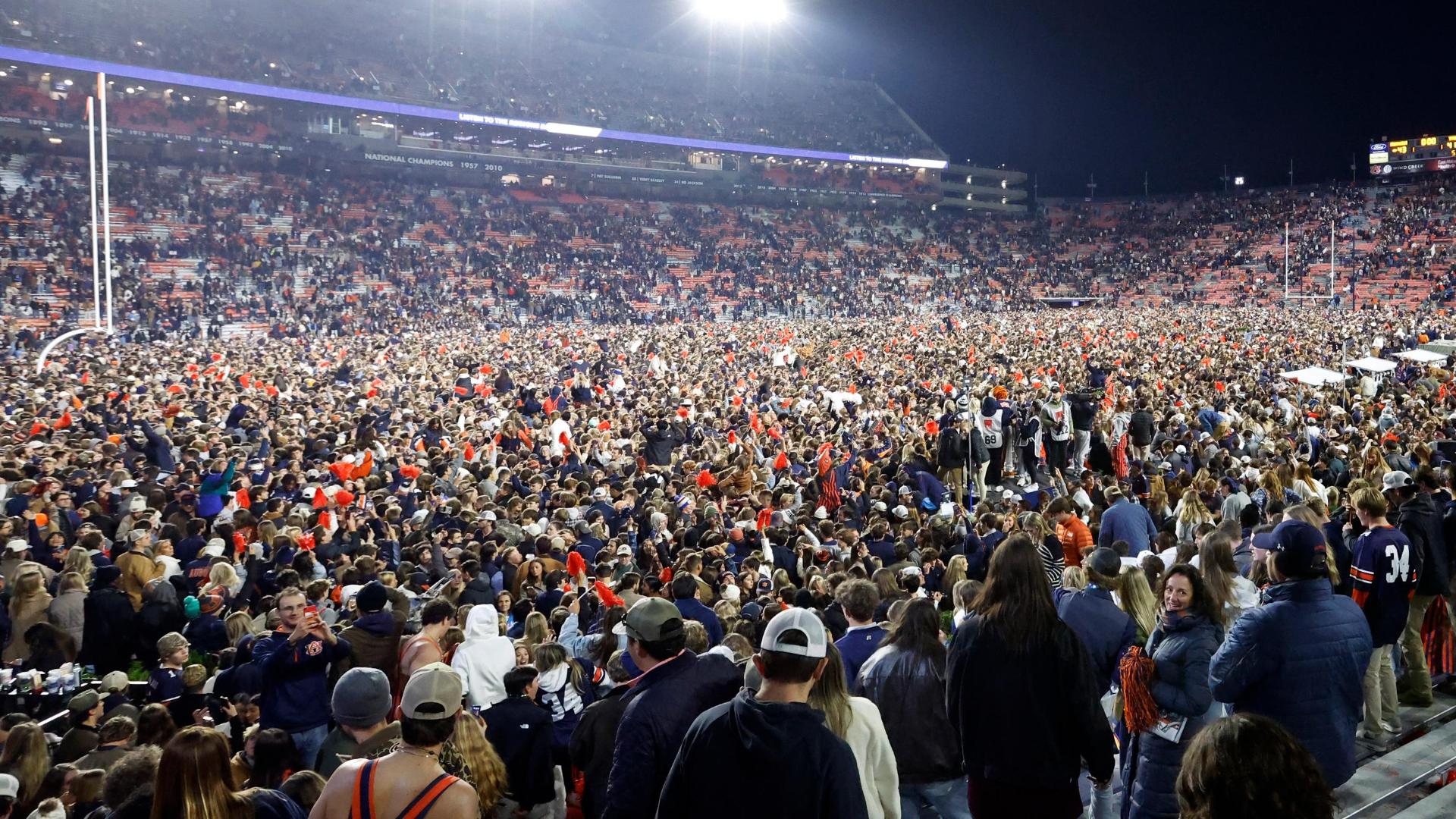 Must See: Auburn fans storm field after stunning Aggies in 4OT thriller ...
