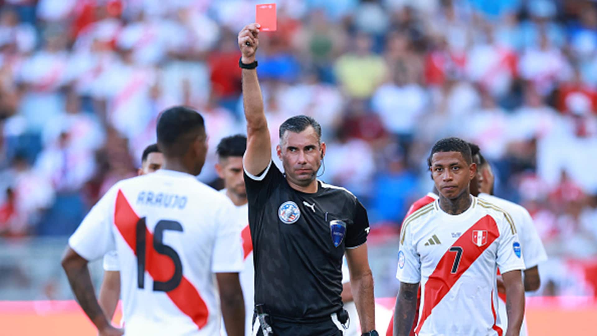 Peru's Araujo is shown the red card after VAR reviewed his tackle on ...