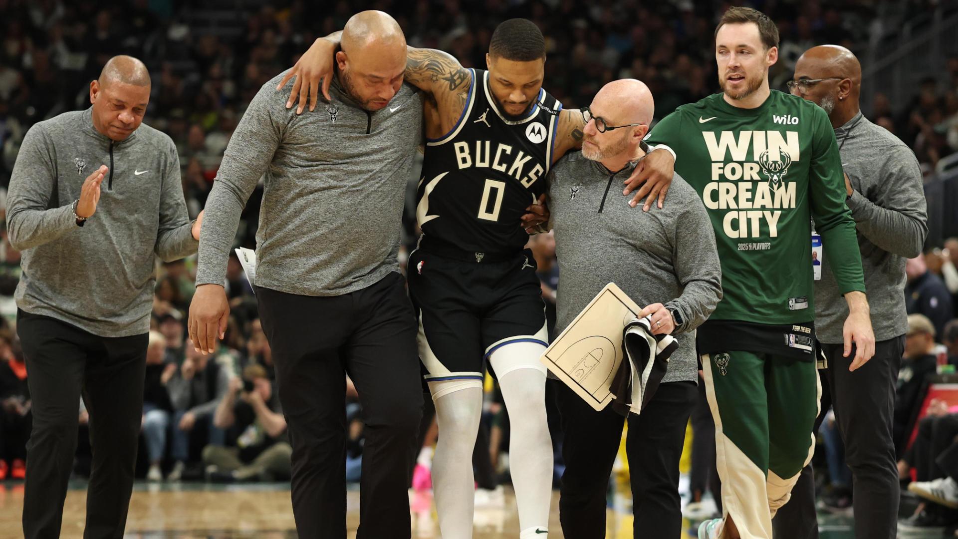 Dame helped off the court after apparent leg injury - Video - TSN